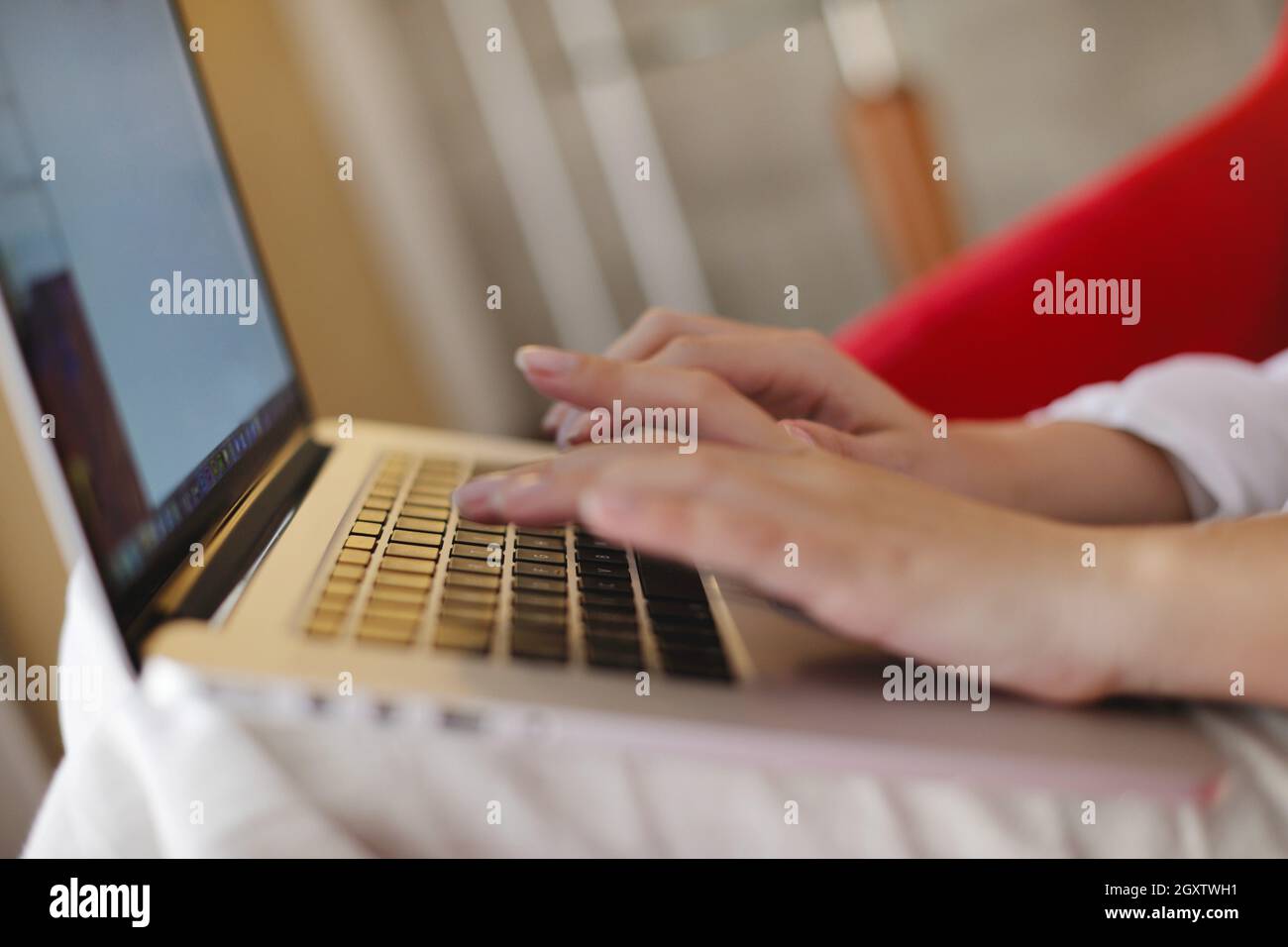 woman working on laptop computer and relax at modern home Stock Photo ...