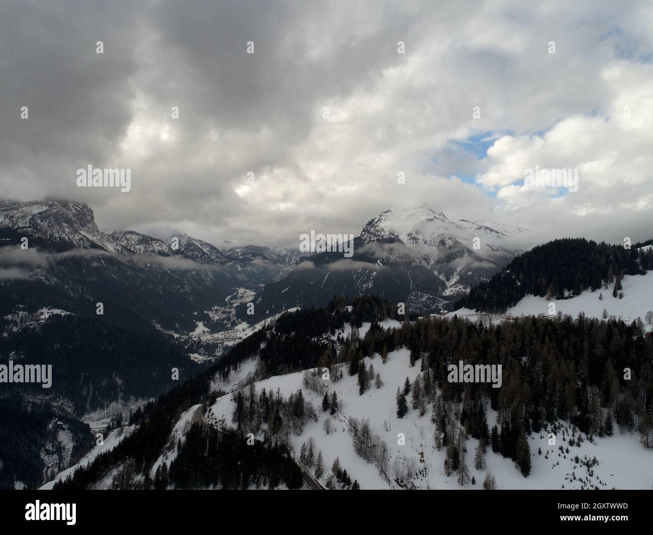 drone flying top view of alps on bad weather winter day Stock Photo - Alamy