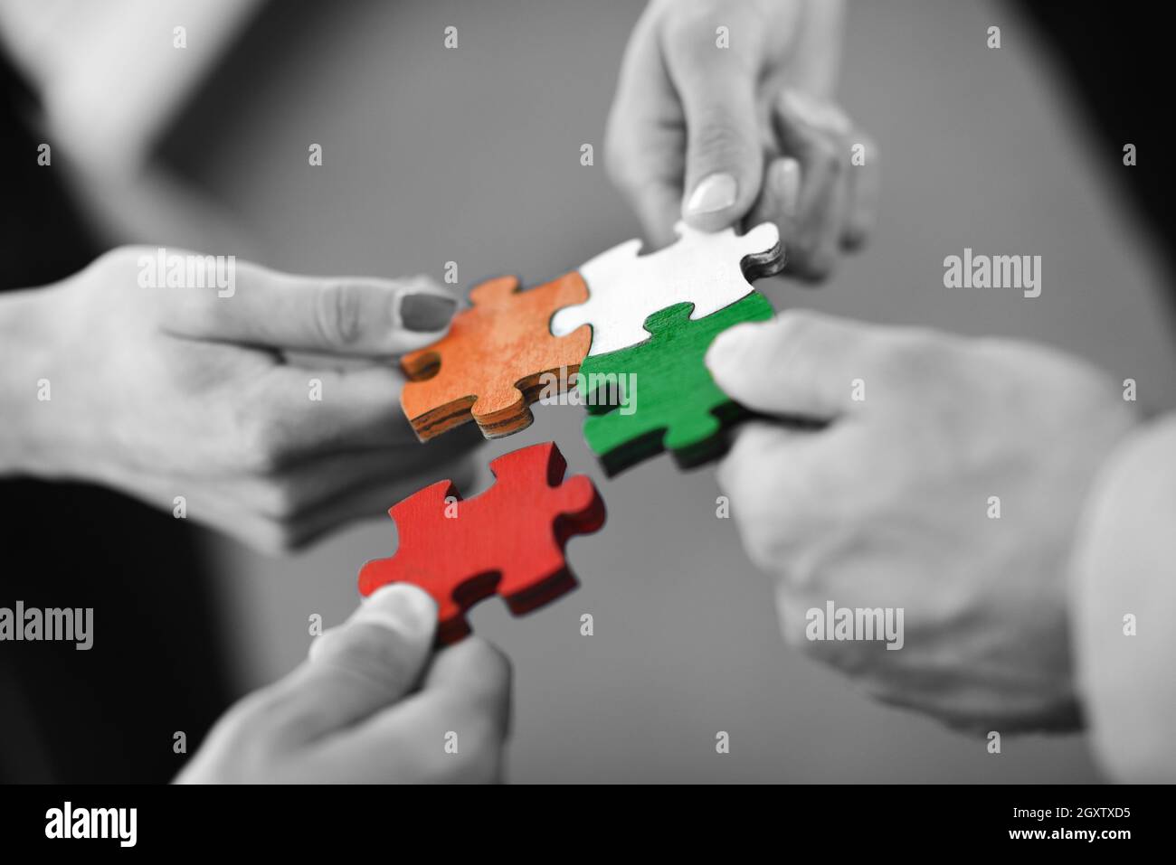 Group of business people assembling jigsaw puzzle and represent team ...