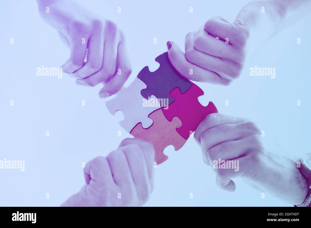 Group of business people assembling jigsaw puzzle and represent team ...