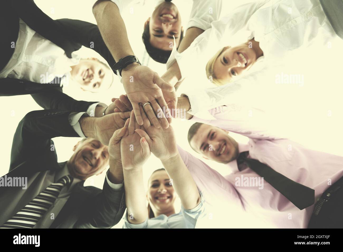 business people group joining hands and representing concept of friendship and teamwork, low ...