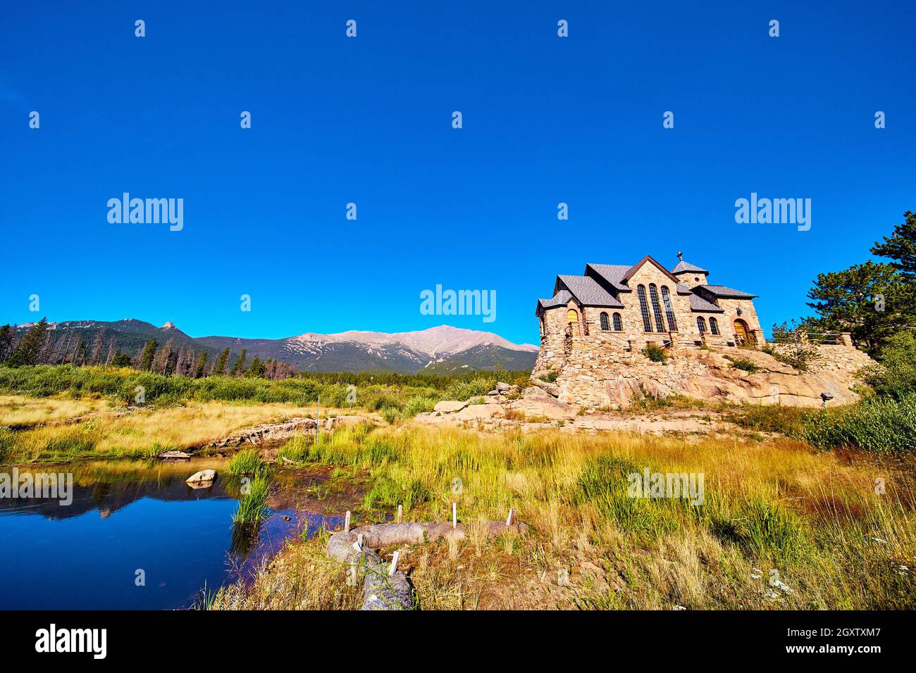 Christian church in mountains by water and desert Stock Photo - Alamy
