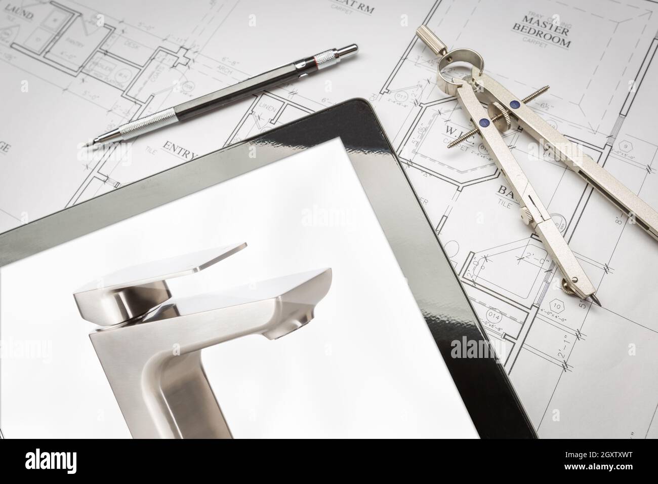Computer Tablet Showing Custom Faucet On House Plans, Pencil, Compass ...