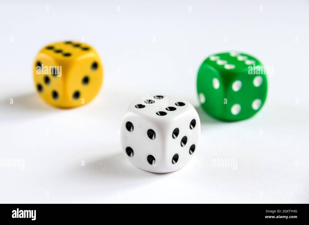 Three colorful dices isolated on white background. Top view Stock Photo ...