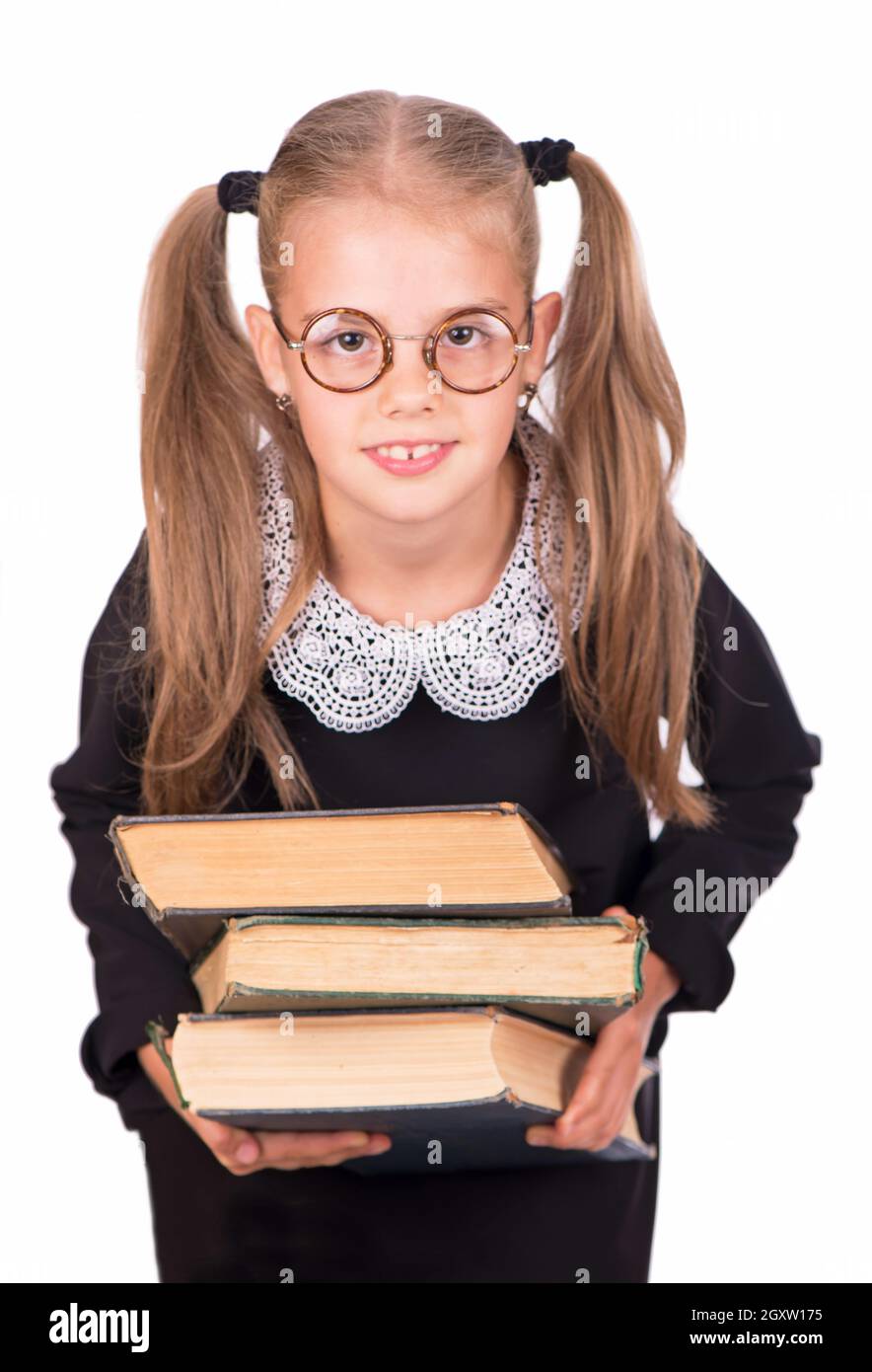 Little schoolgirl holding books hi-res stock photography and images - Alamy