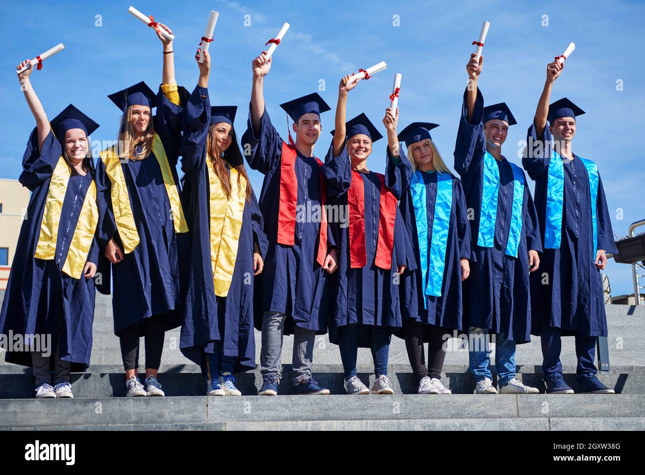 young graduates students group standing in front of university building ...