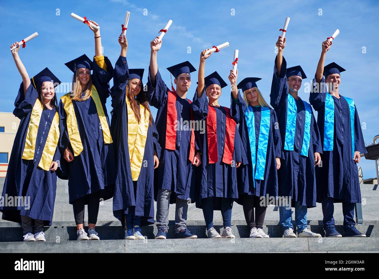 young graduates students group standing in front of university building ...