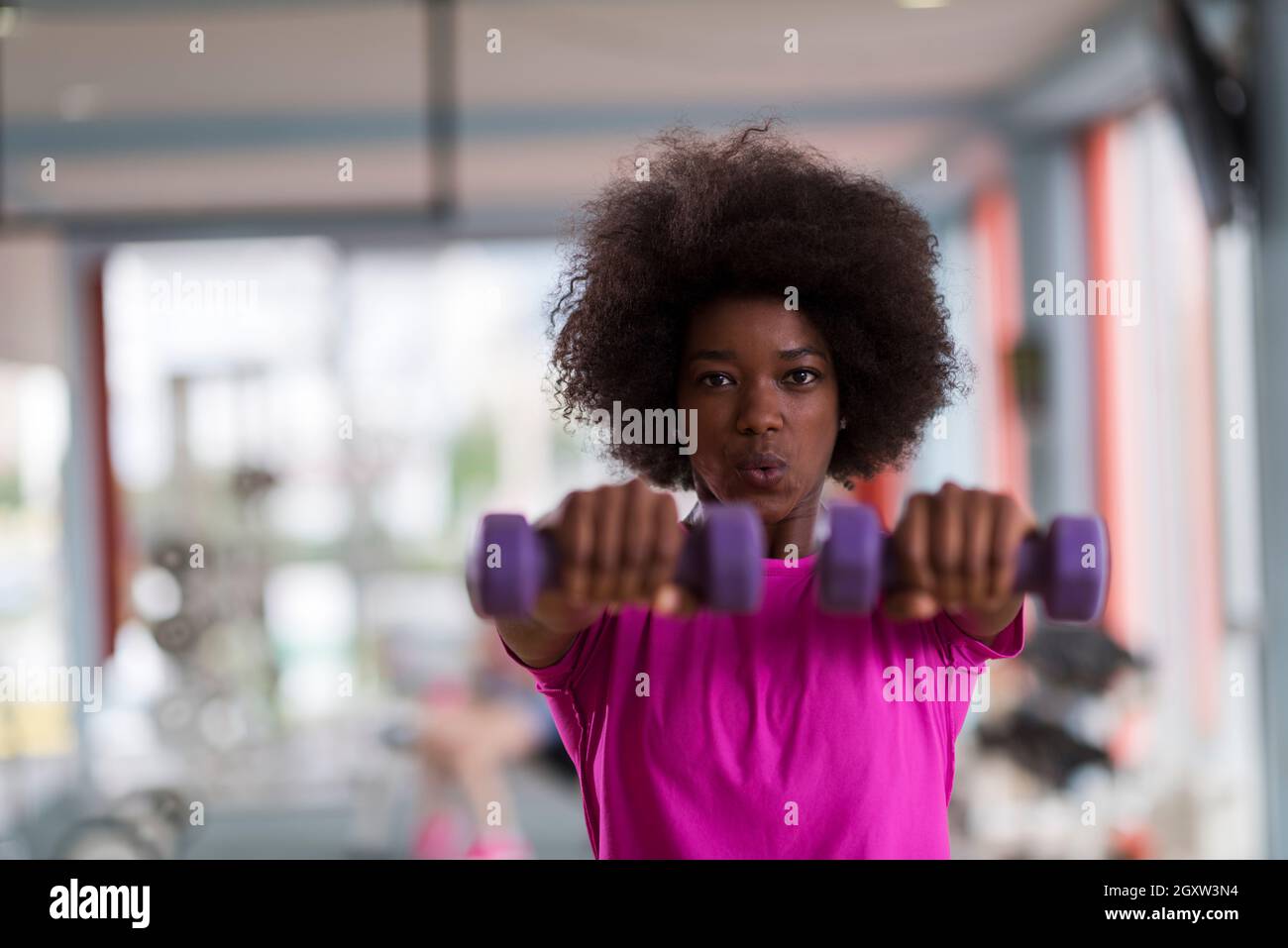 happy healthy african american woman working out in a crossfit gym on ...