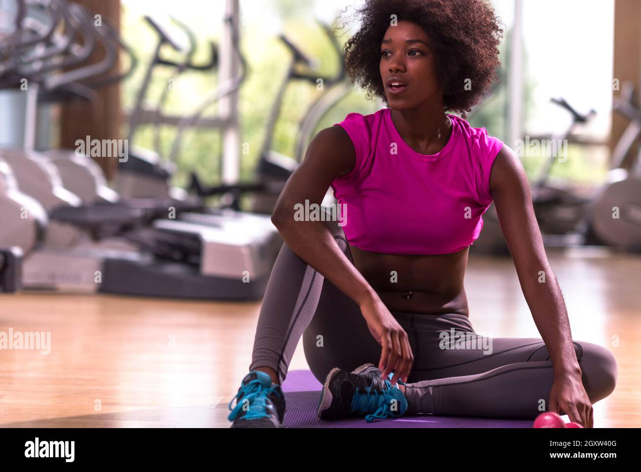 beautiful young african american woman exercise yoga in gym Stock Photo ...