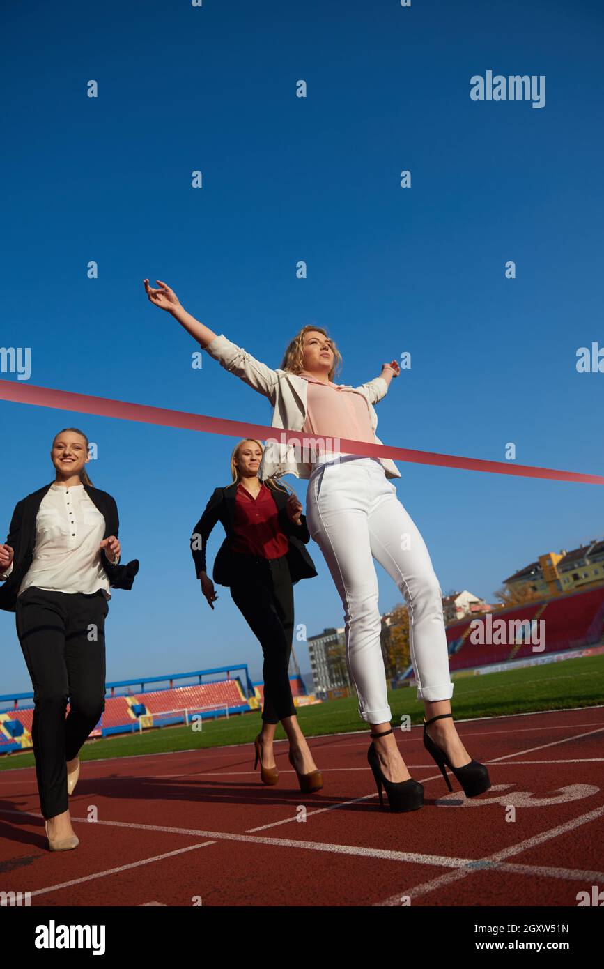 business people running together on racing track Stock Photo - Alamy
