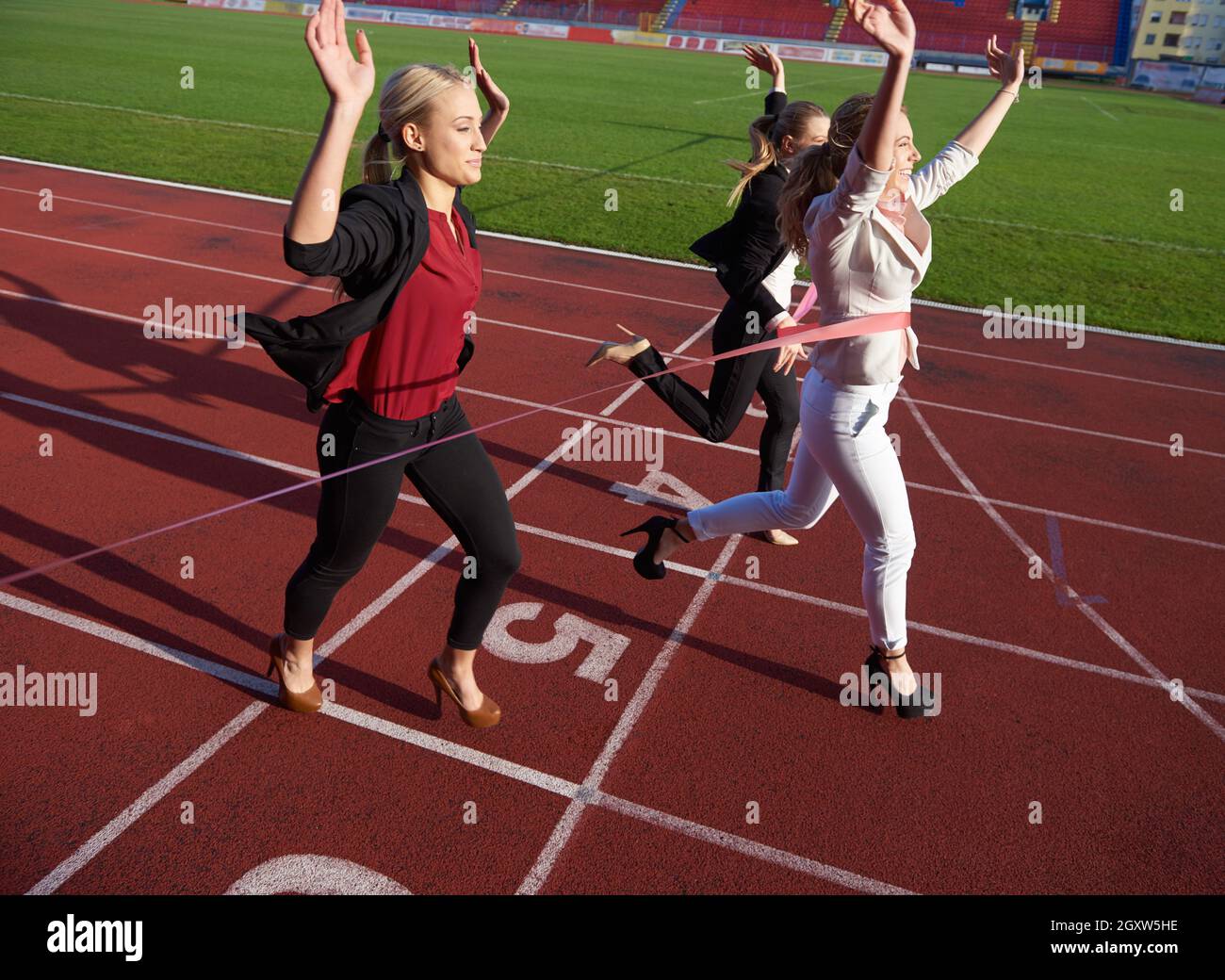 business people running together on athletics racing track Stock Photo ...