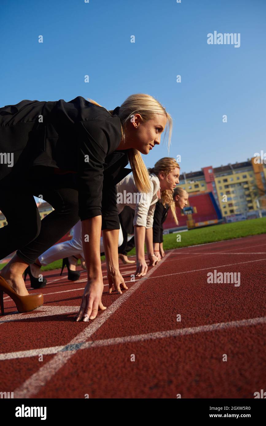 business people running together on racing track Stock Photo - Alamy