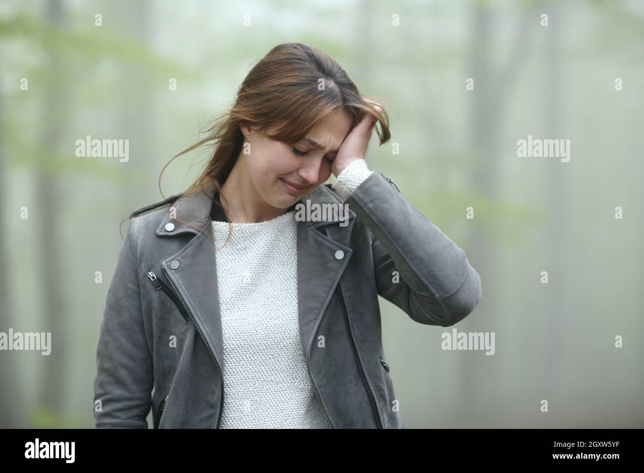 Frustrated woman in forest hi-res stock photography and images - Alamy
