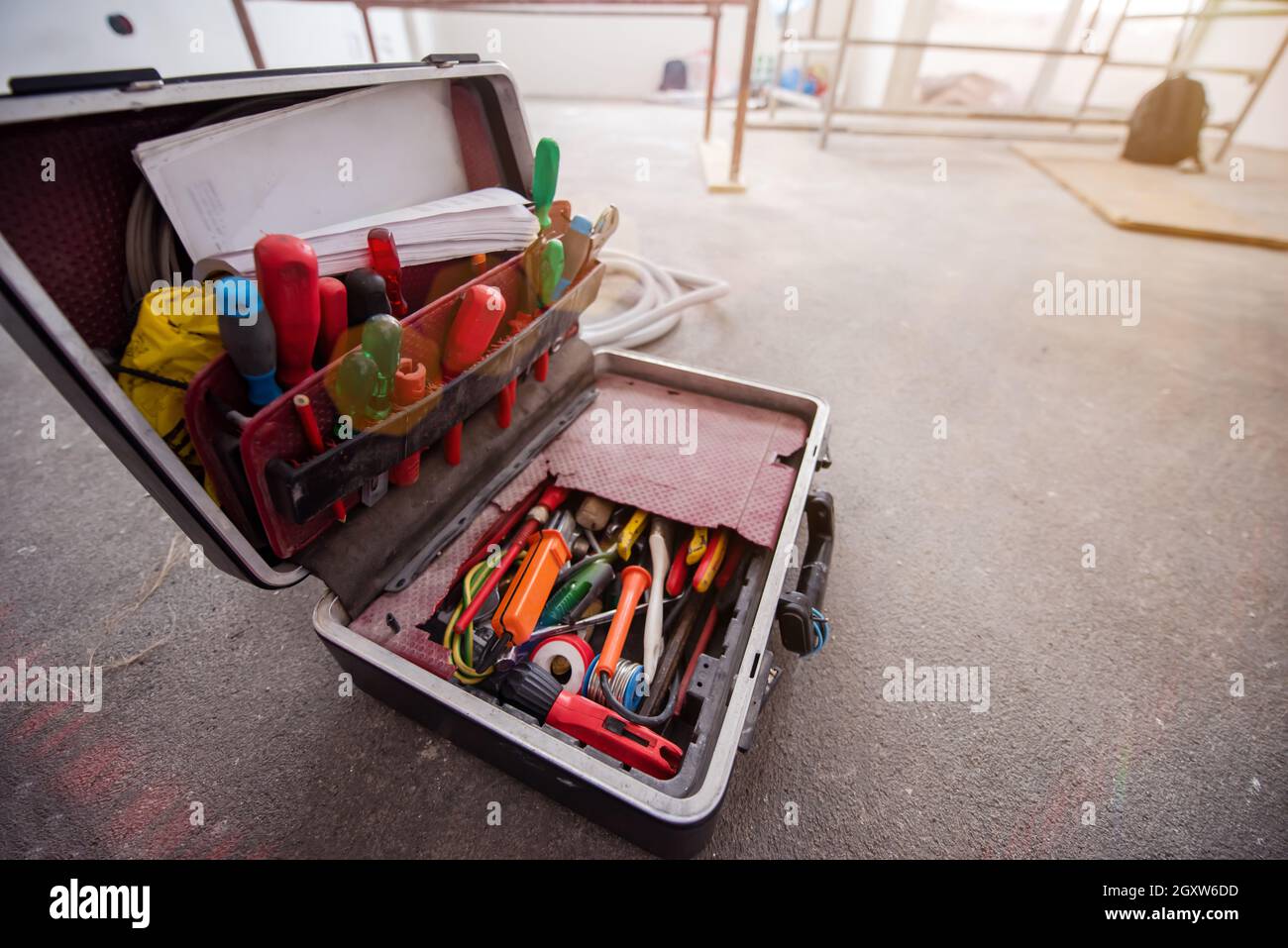 toolbox full of hand tools on real dusty floor background at ...