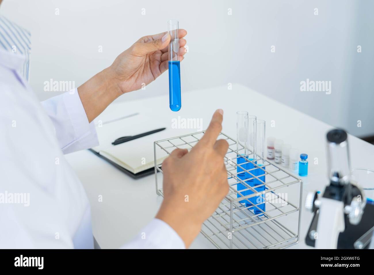 Scientist wear lab coat and protective wear are working with research ...