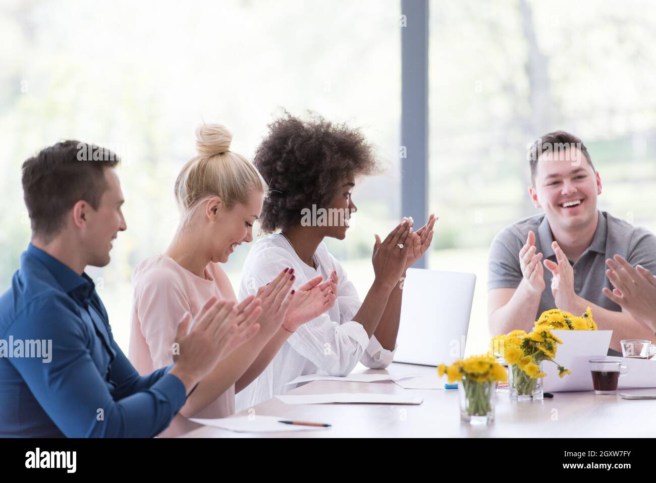 multiethnic Group of young business people looking happy while ...