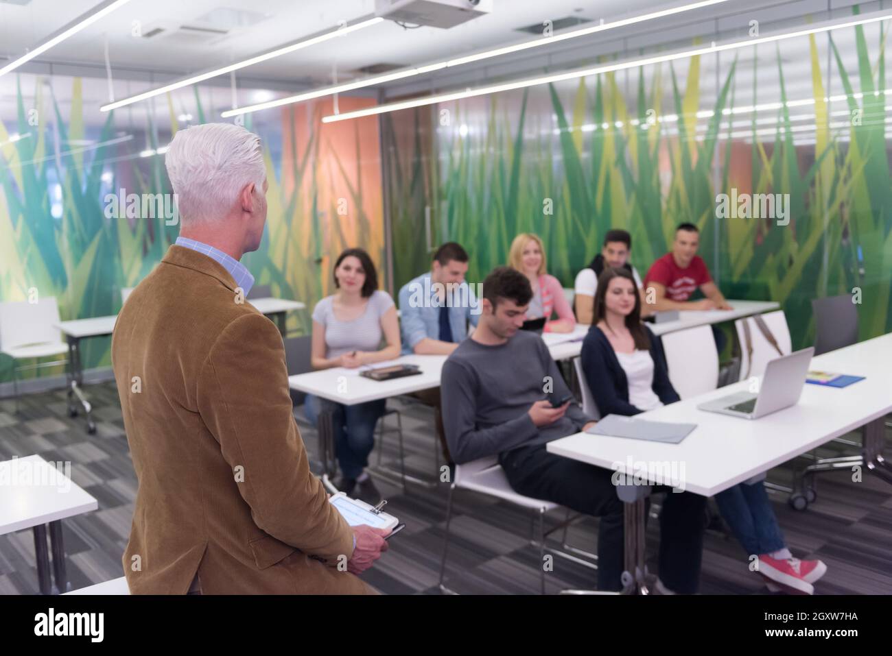 group of students study with professor in modern school classroom Stock ...