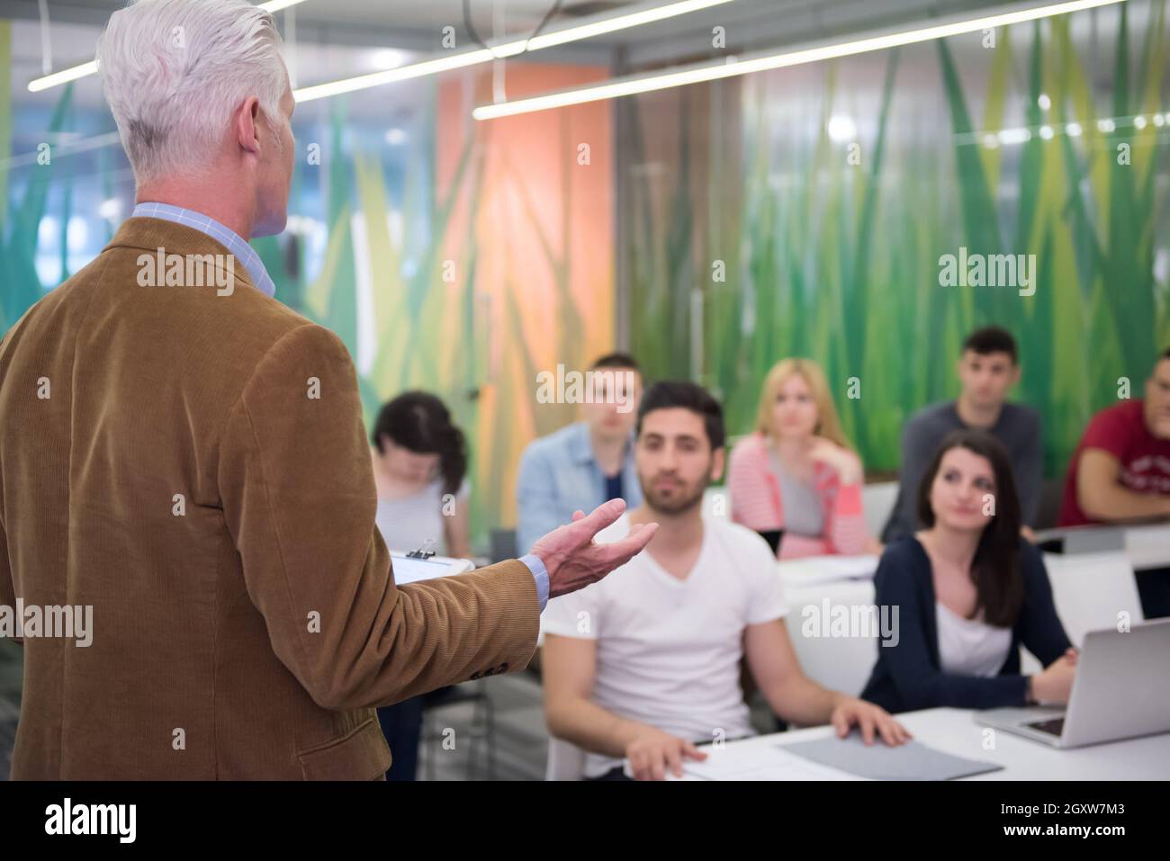 group of students study with professor in modern school classroom Stock ...
