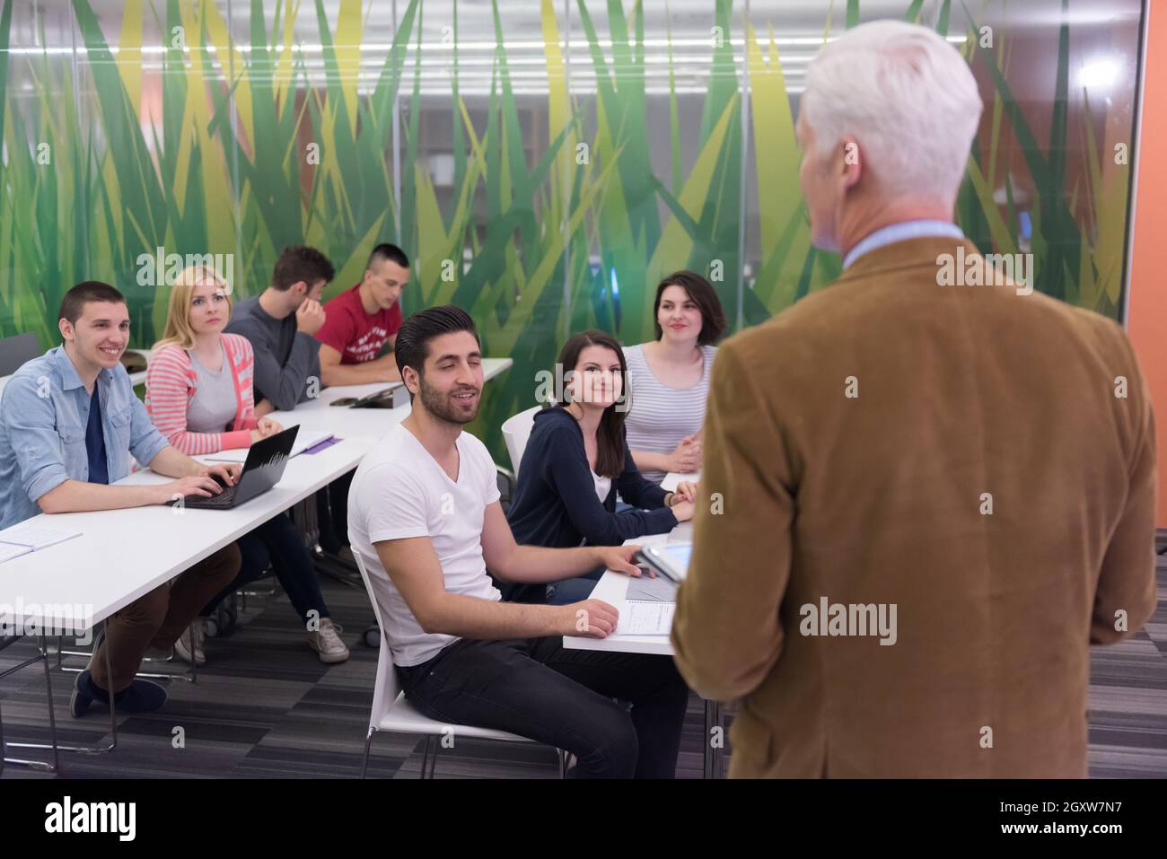 group of students study with professor in modern school classroom Stock ...