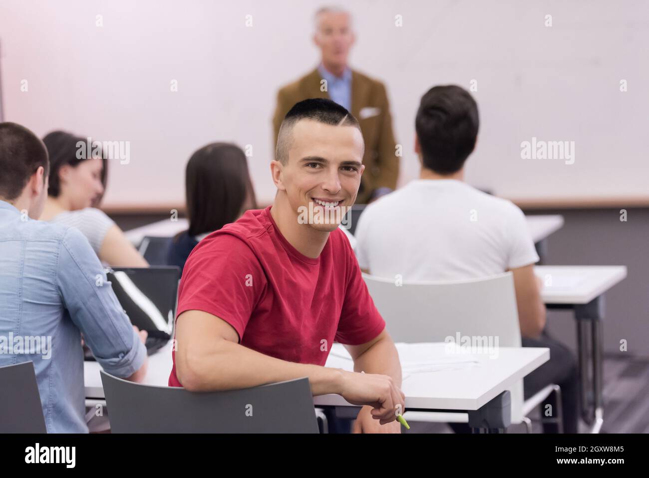 technology students group in computer lab school classroom working on ...