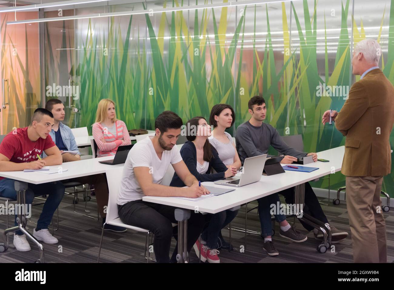 group of students study with professor in modern school classroom Stock ...