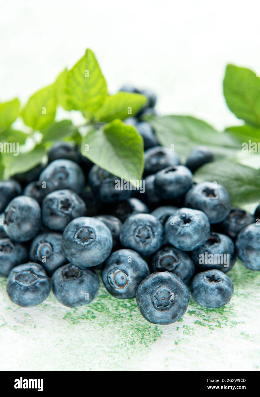 Freshly picked blueberries on a wooden background. Concept for healthy ...