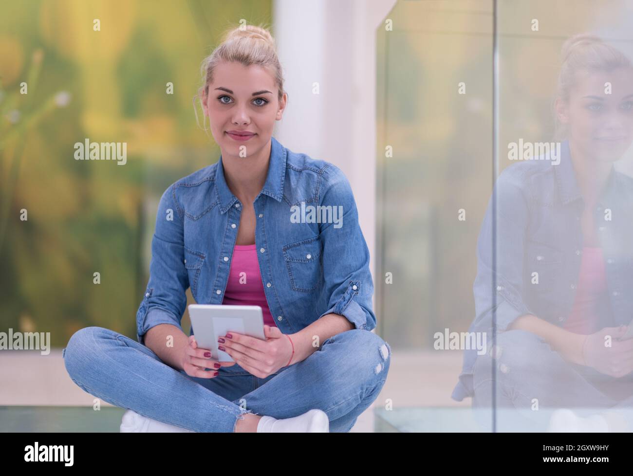 beautiful young women using tablet computer on the floor at home Stock ...