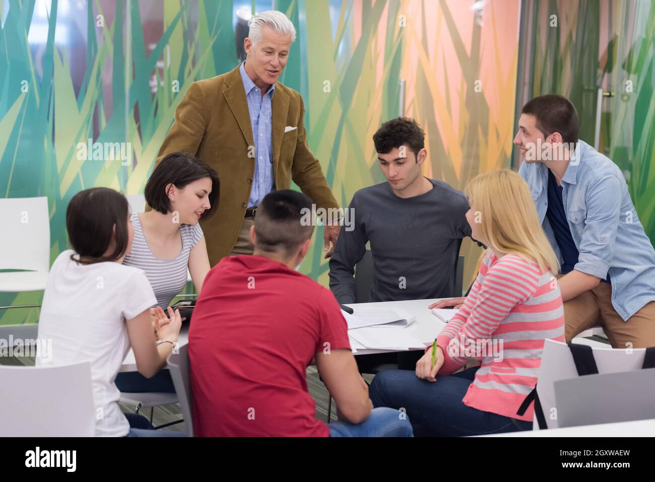 group of students study with professor in modern school classroom Stock ...