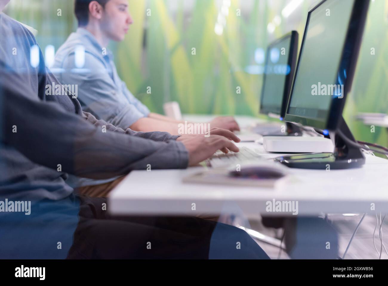 technology students group in computer lab school classroom working on ...