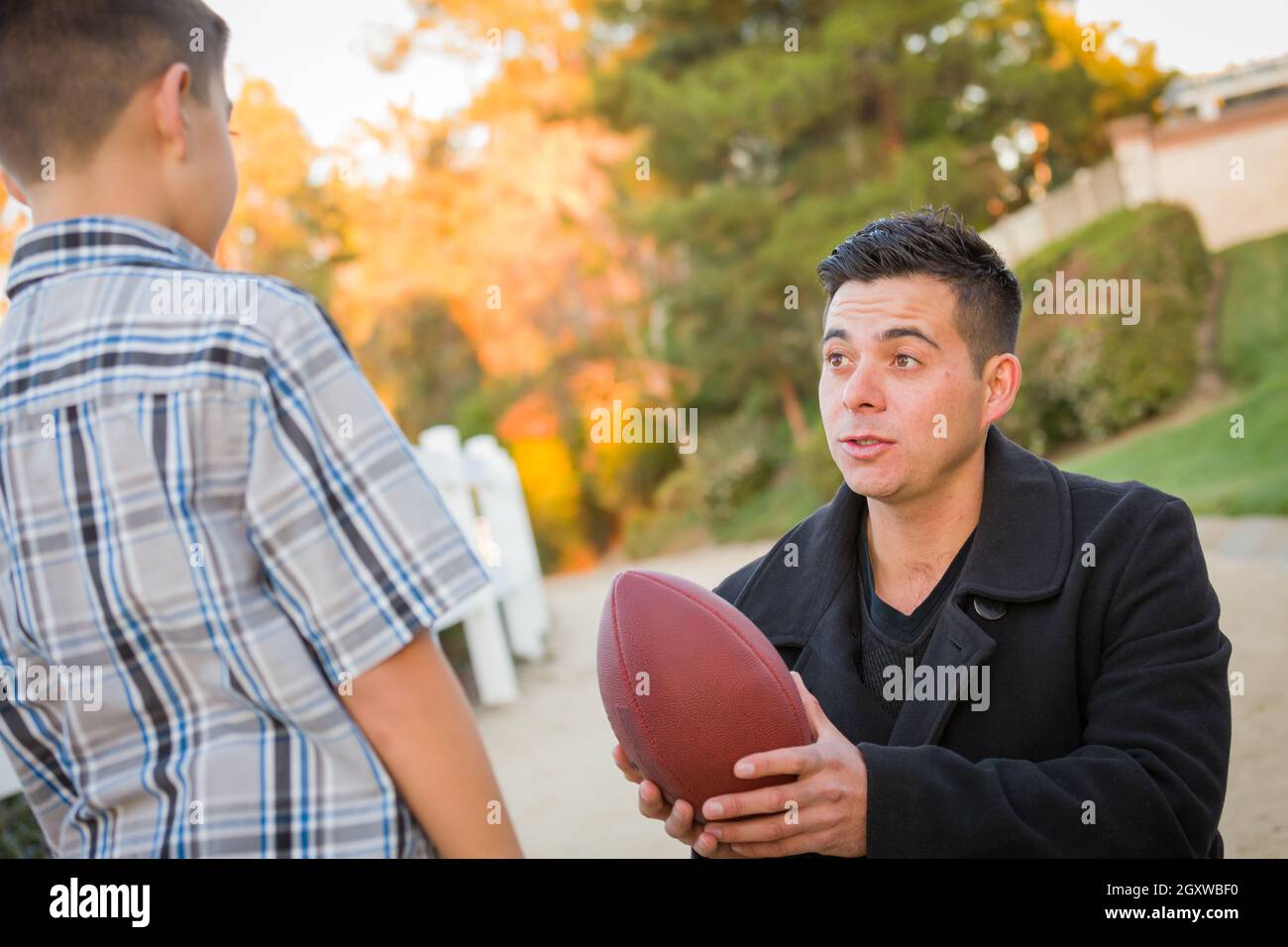 Father teaching son football hi-res stock photography and images - Alamy