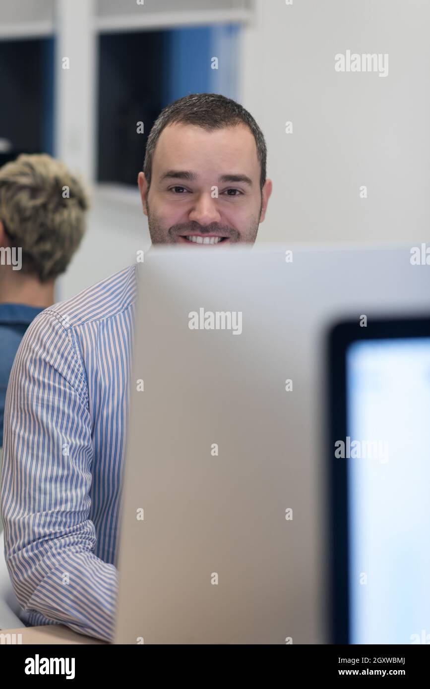 startup business, software developer working on desktop computer at ...