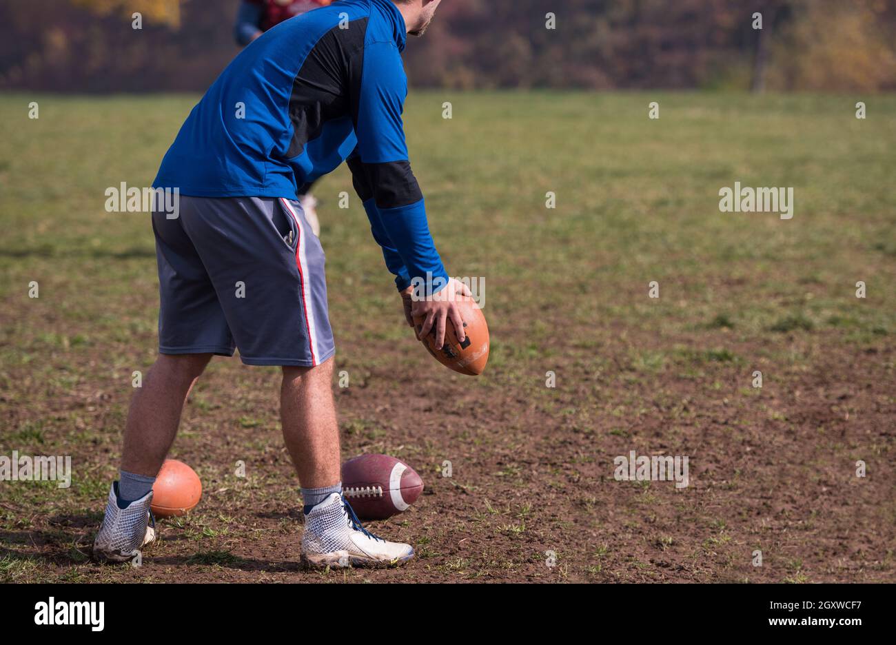 american football kicker practicing football kickoff closeup shot Stock ...