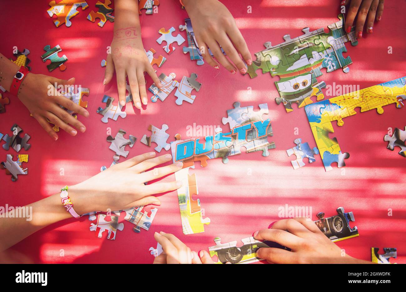 top view of kids hands playing with puzzles in outdoor playground Stock ...