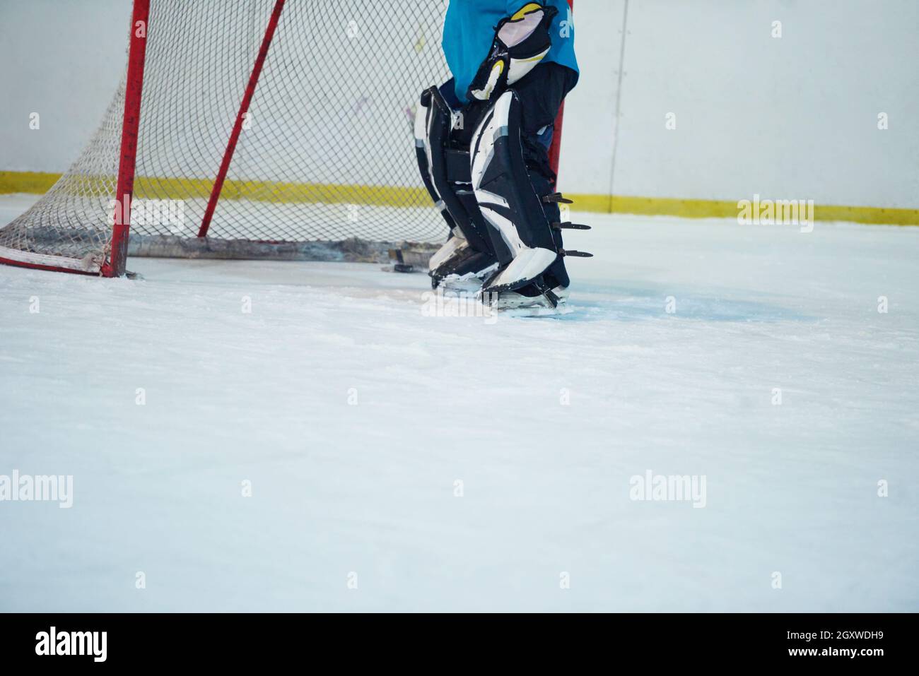 ice hockey player in action kicking with stick Stock Photo - Alamy