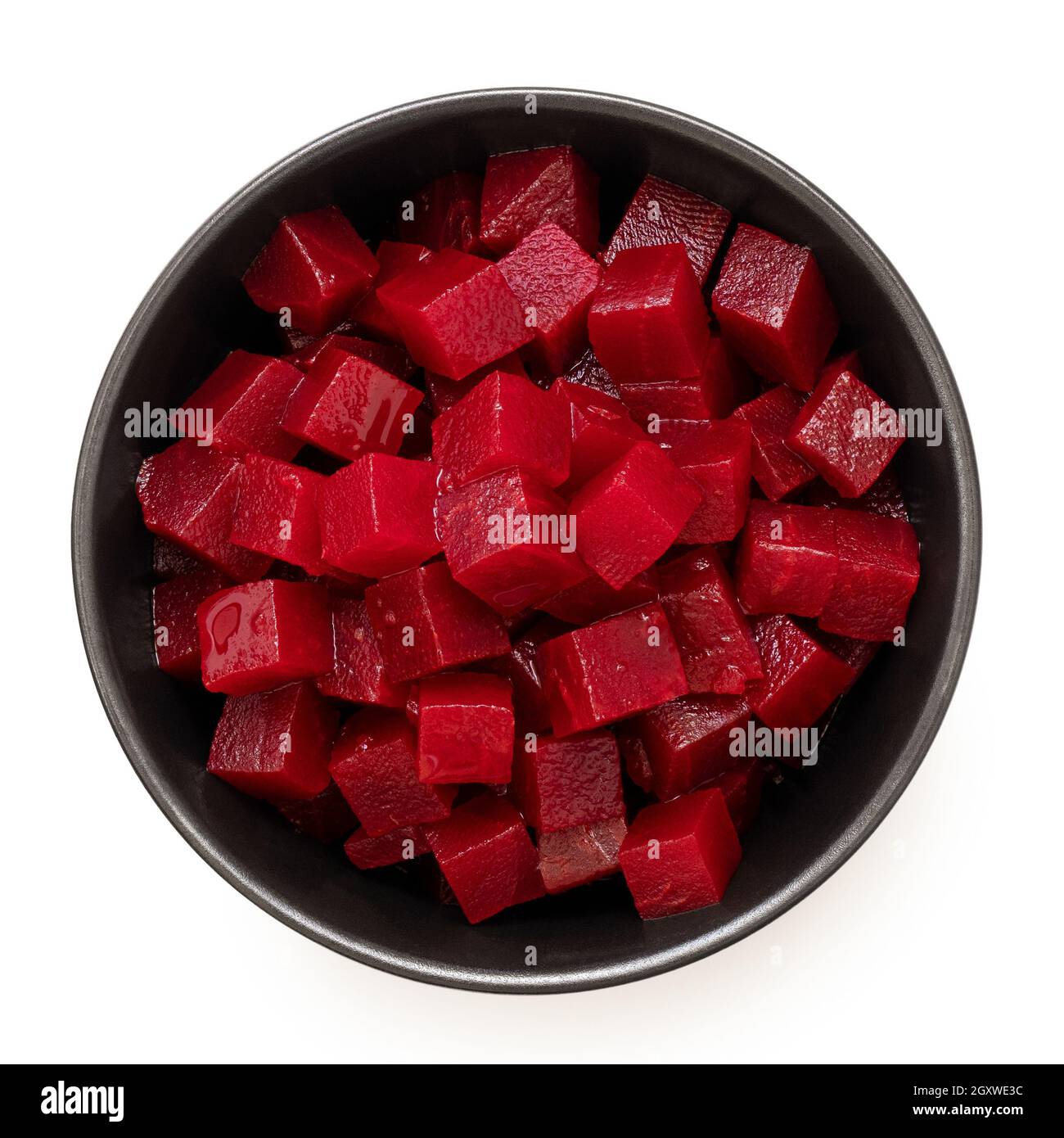 Cooked chopped beetroot in black ceramic bowl isolated on white. Top ...