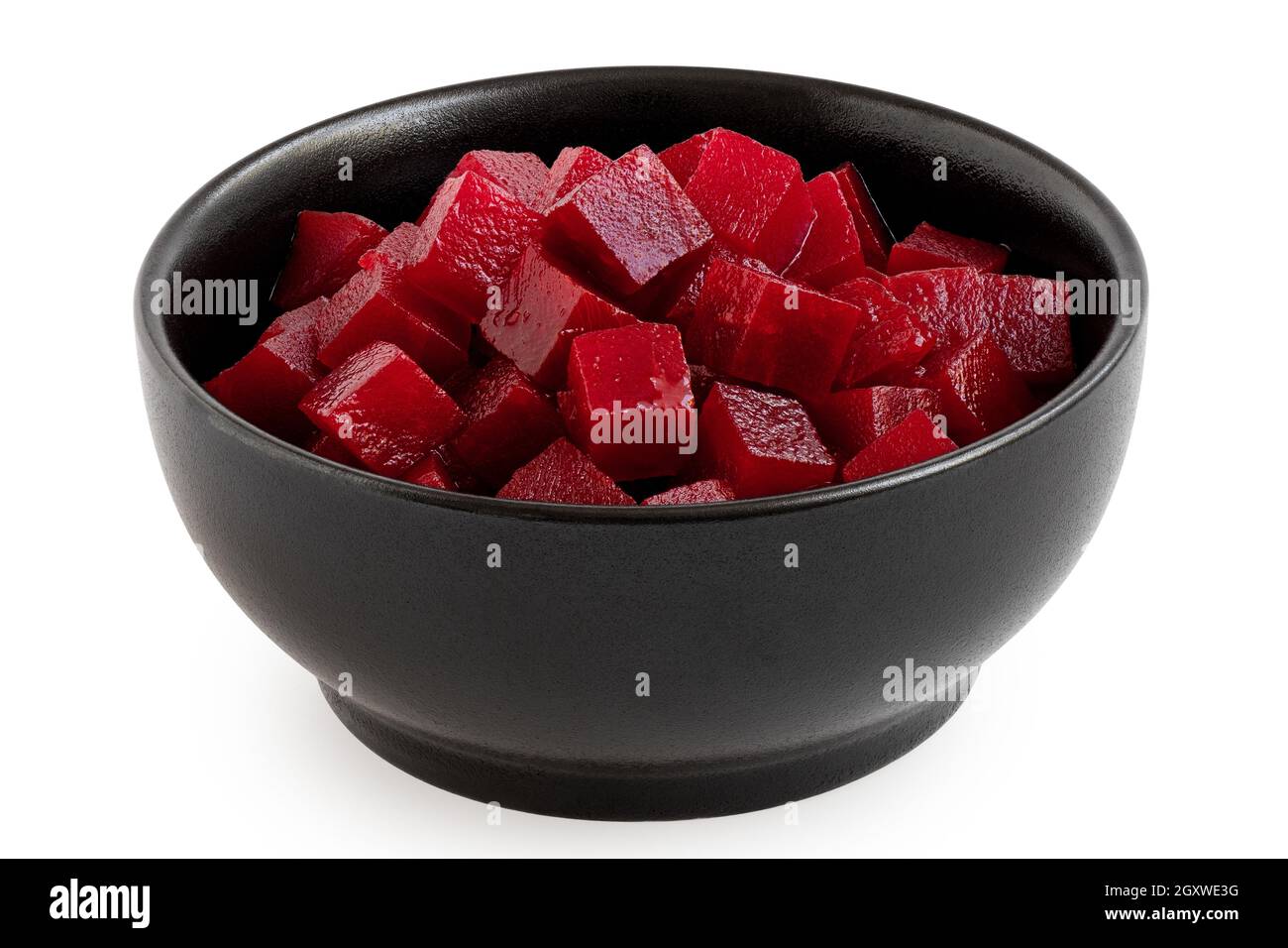 Cooked chopped beetroot in black ceramic bowl isolated on white Stock ...