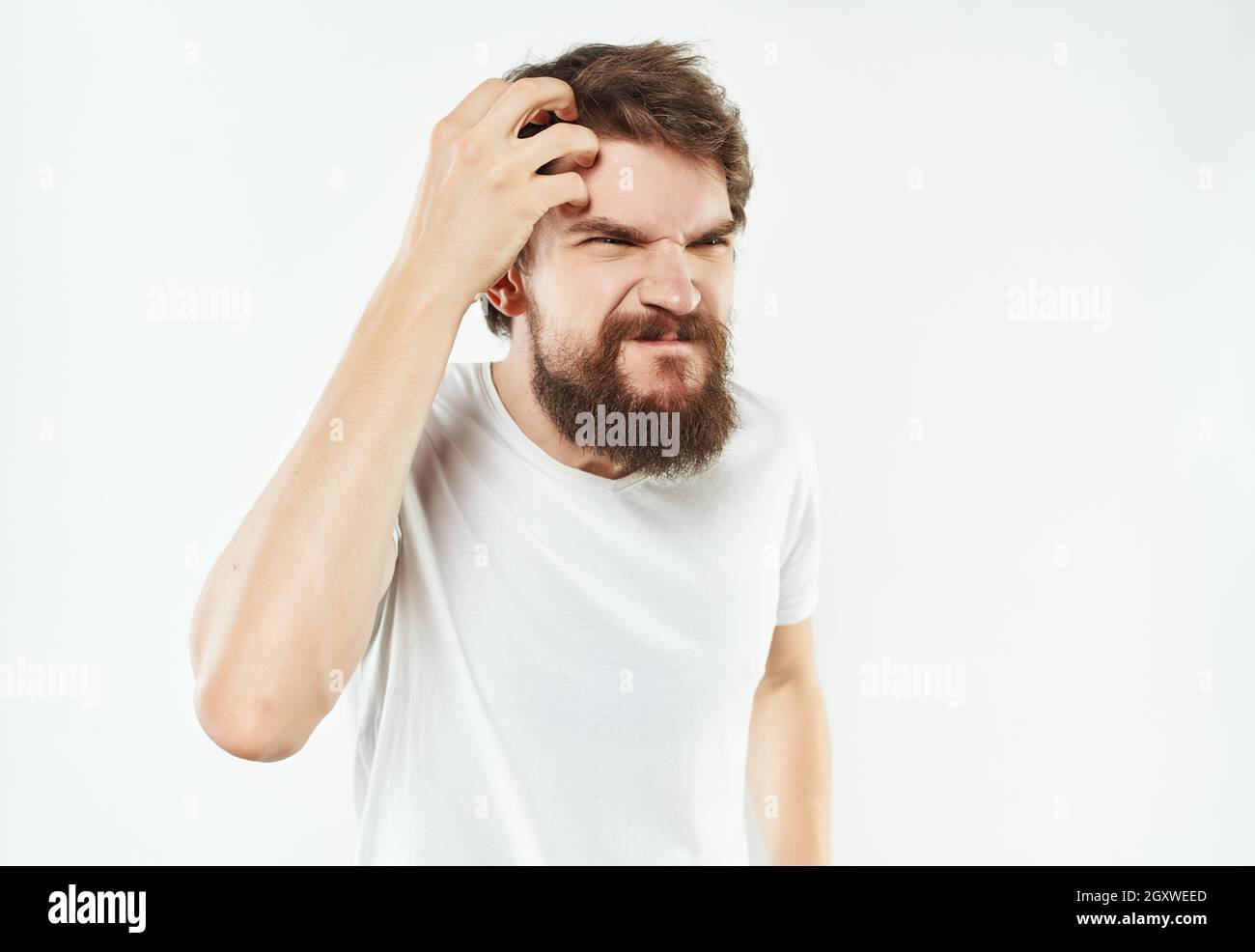 Man in a white t-shirt expressive look discontent Lifestyle Stock Photo ...
