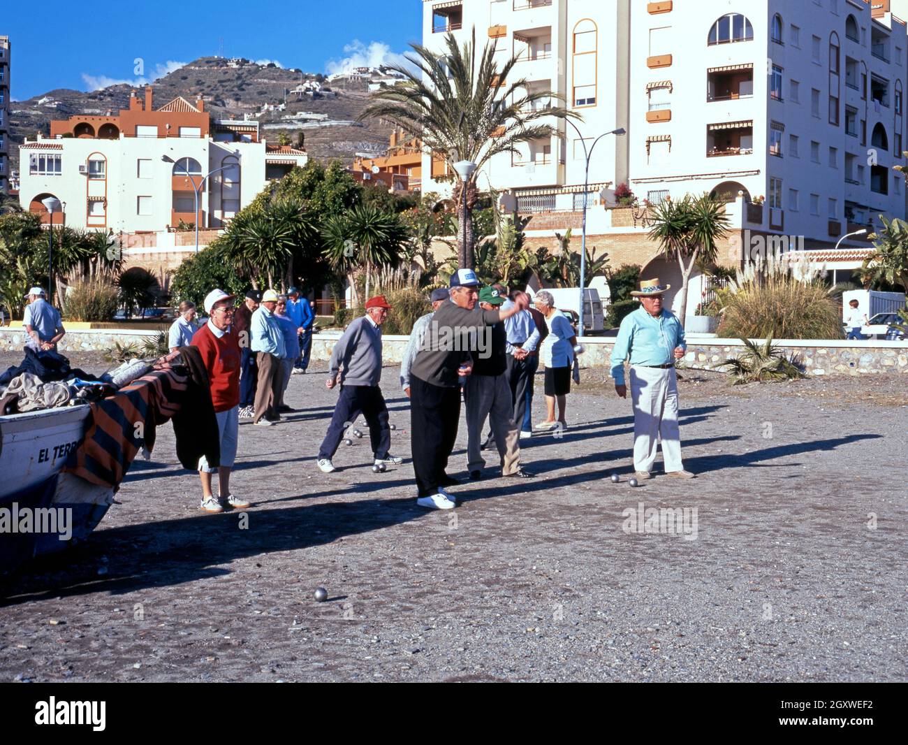 People playing ball game on beach (Petanque), Almunecar, Spain Stock ...
