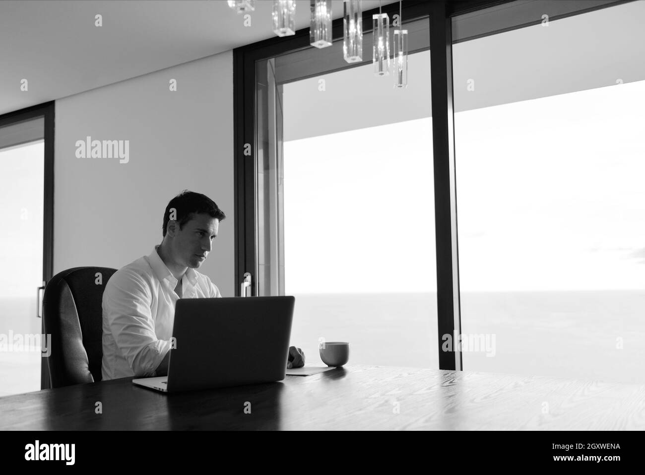 frustrated with problems young business man working on laptop computer ...