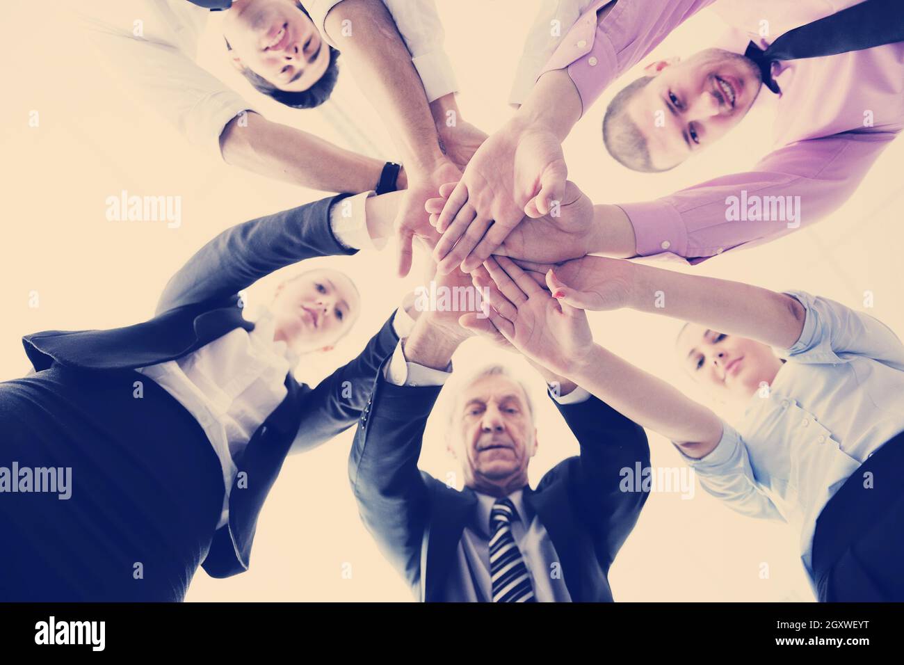business people group joining hands and representing concept of friendship and teamwork, low ...