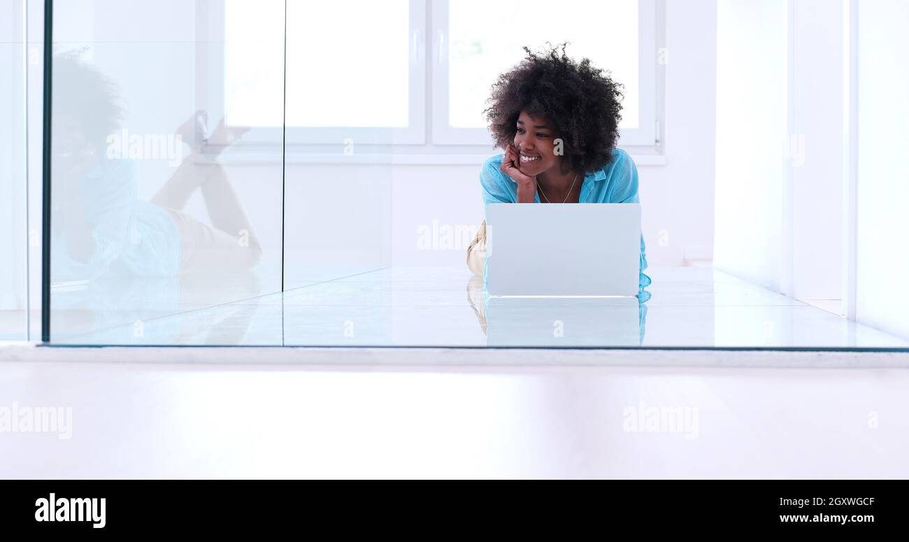 beautiful young african american women using laptop computer on the ...