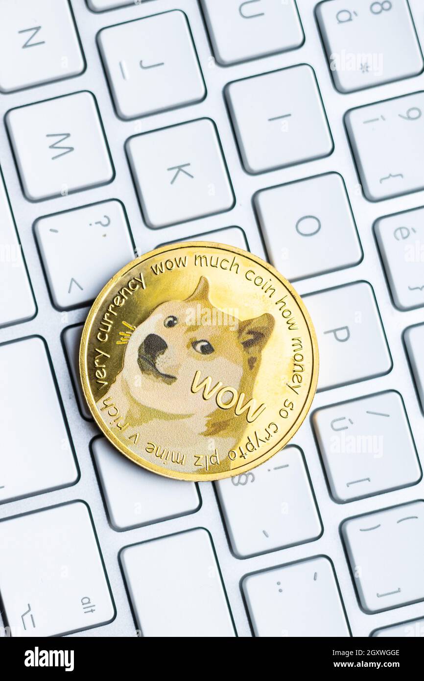 Golden dogecoin coin. Cryptocurrency dogecoin. Doge cryptocurrency and computer keyboard. Top ...