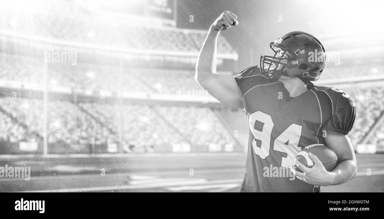 american football player celebrating touchdown on big modern stadium ...