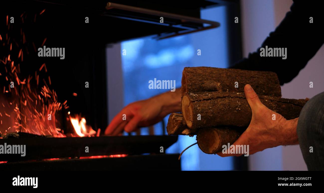 Closeup of human hands at fireplace making fire Stock Photo - Alamy