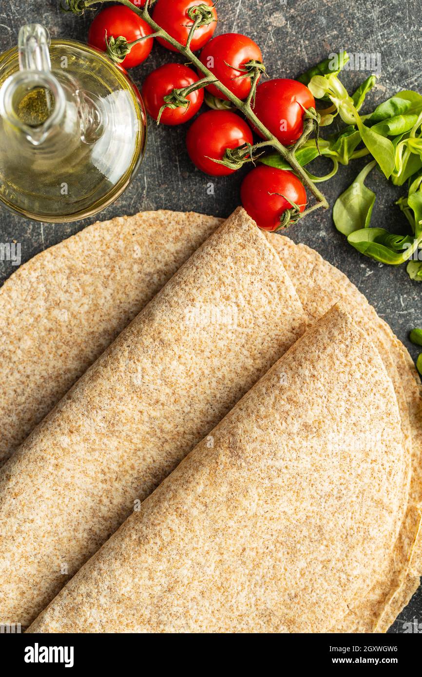 Whole grain tortilla wraps on kitchen table. Top view Stock Photo - Alamy