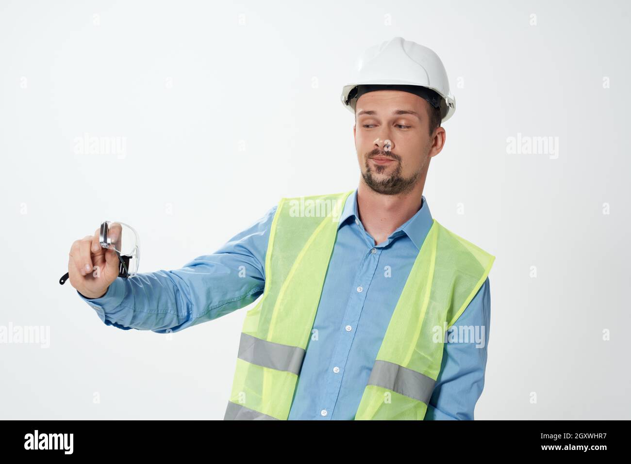 male builders Professional Job light background Stock Photo - Alamy
