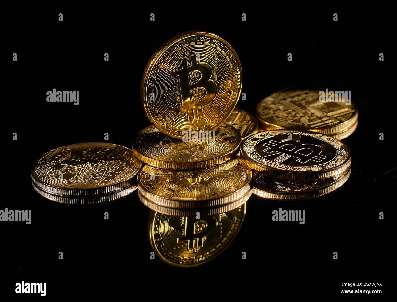 Leader in cryptocurrency bitcoin BTC on a top of coins against black ...
