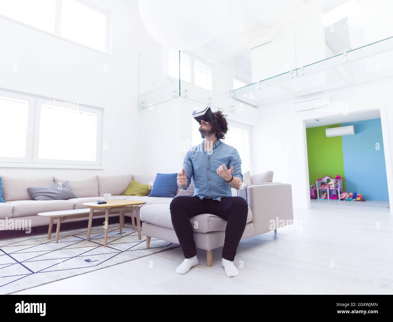 happy man getting experience using VR-headset glasses of virtual ...