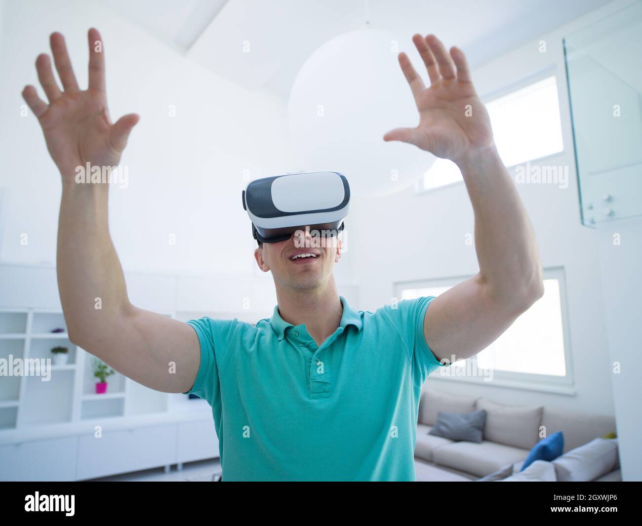 happy man getting experience using VR-headset glasses of virtual ...
