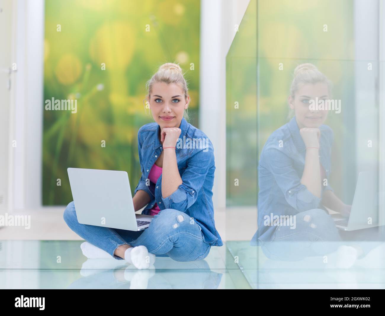 beautiful young woman using laptop computer on the floor at home Stock ...